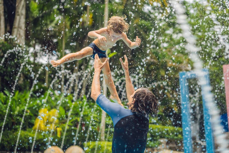 Dad and Son Have Fun in the Pool Stock Photo - Image of parenting ...