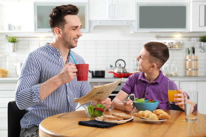 Dad and Son Having Breakfast Together Stock Photo - Image of healthy ...