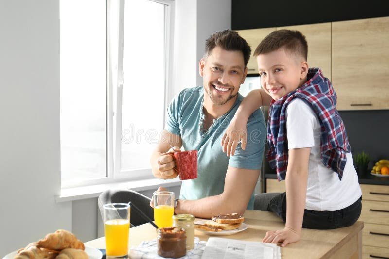 Dad and Son Having Breakfast Together in Stock Image - Image of copy ...
