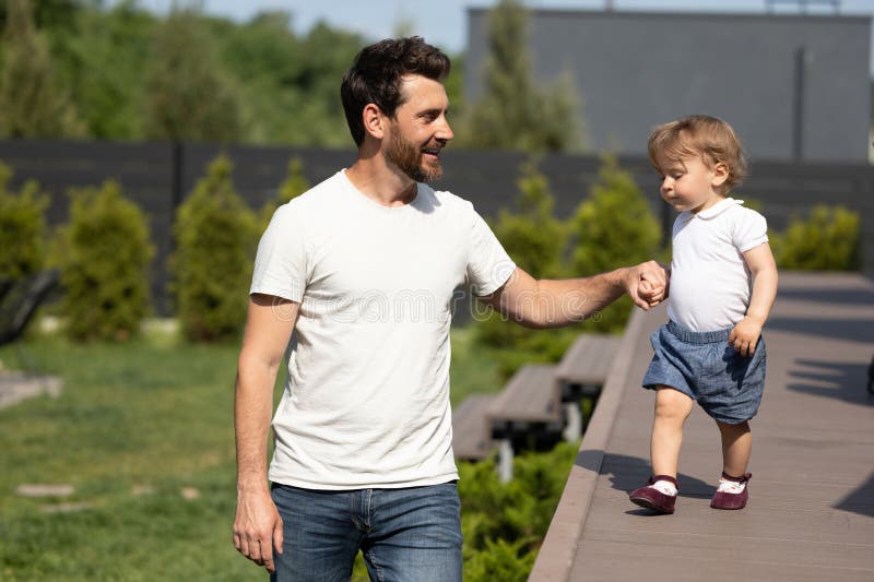 Dad and Son Having a Walk and Looking Contented Stock Image - Image of ...