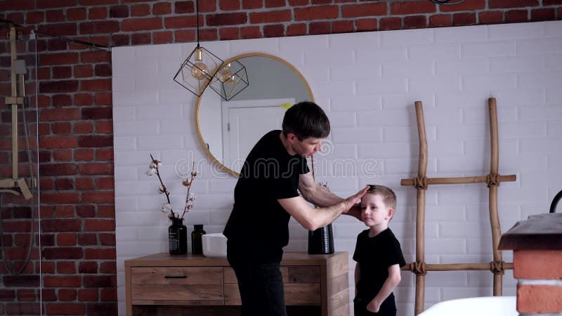 Dad and son are home alone stock video. Video of happiness - 216358125