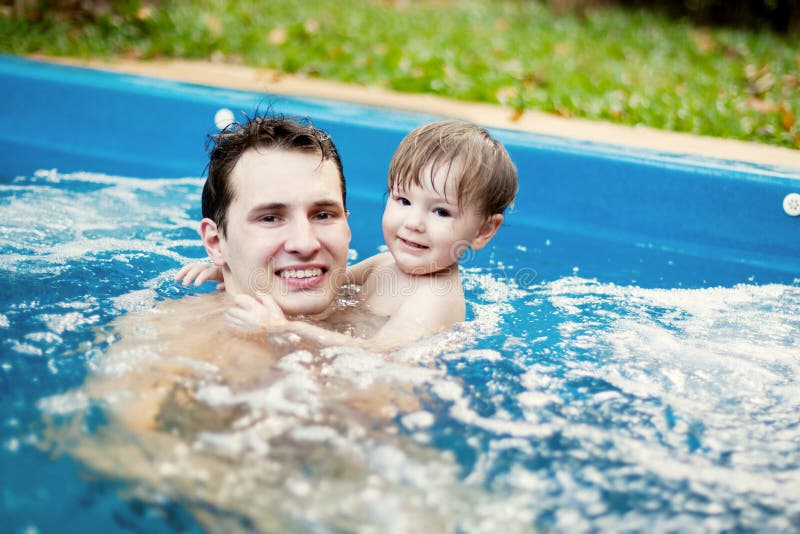 Dad and son swimming stock photo. Image of loving, care - 13751906