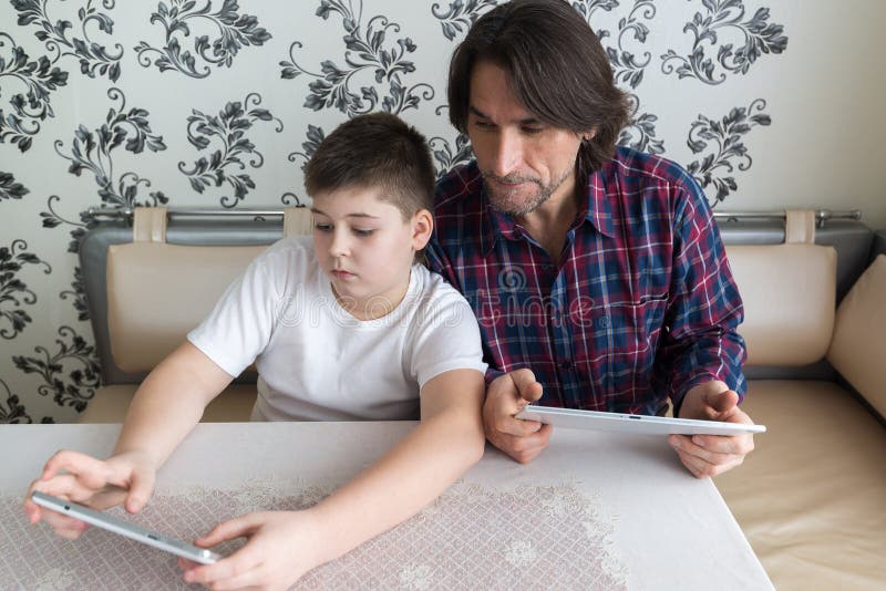 Dad and Son with Tablet Computer Indoor Stock Photo - Image of daddy ...