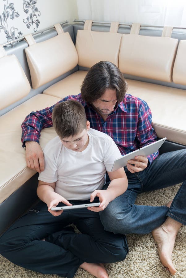 Dad and Son with Tablet Computer Indoor Stock Photo - Image of device ...