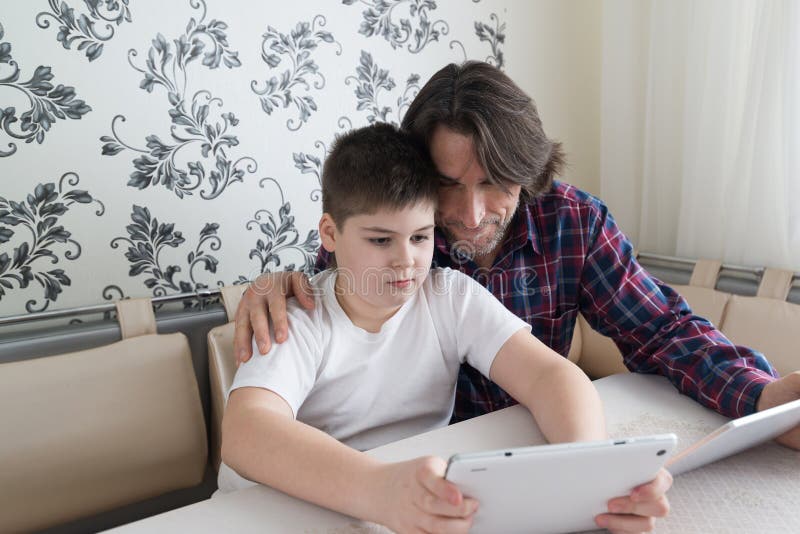 Dad and Son with Tablet Computer Indoor Stock Photo - Image of leisure ...