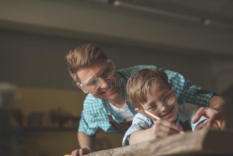 Dad and son at work stock image. Image of work, person - 120943107
