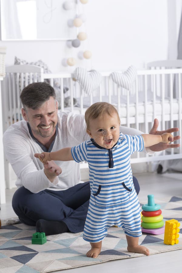 Dad Supporting Baby Making First Steps Stock Photo - Image of baby ...