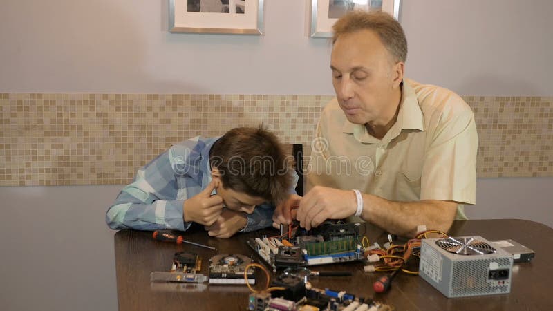 Dad Teaches His Son a Teenager, What`s Inside the Computer Stock ...