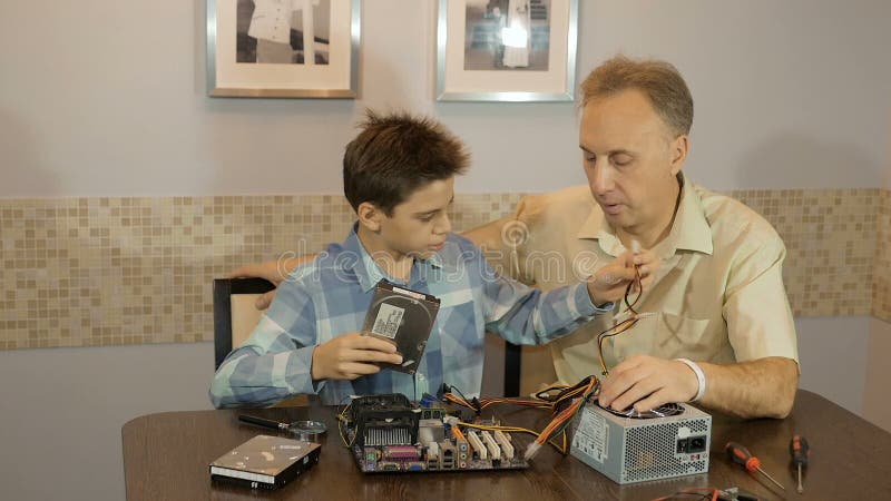 Dad Teaches His Son a Teenager, What`s Inside the Computer. the ...