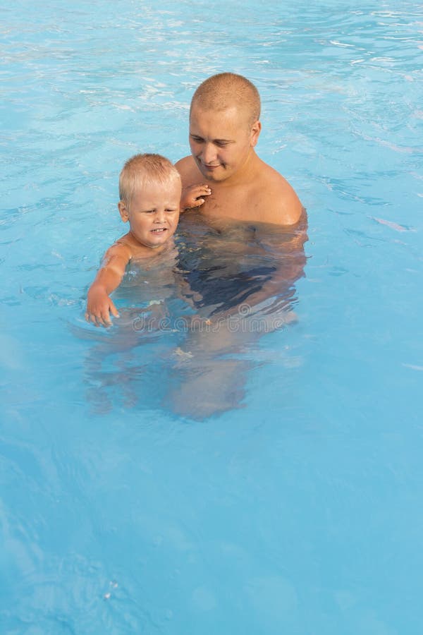Dad Teaches His Son To Swim Stock Image - Image of amusement, fiesta ...