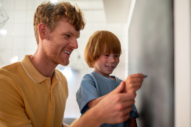 Dad Teaching a Little Boy To Write on the Blackboard Stock Image - Image of learning, childhood ...