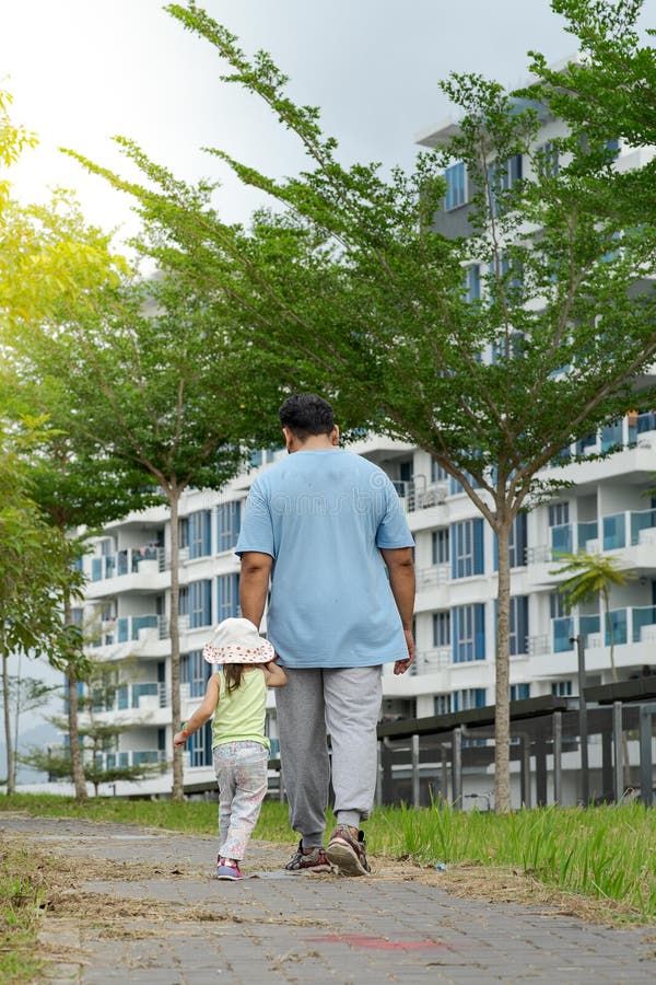 Dad Walks with Her Daughter in the Neighbourhood Stock Photo - Image of ...