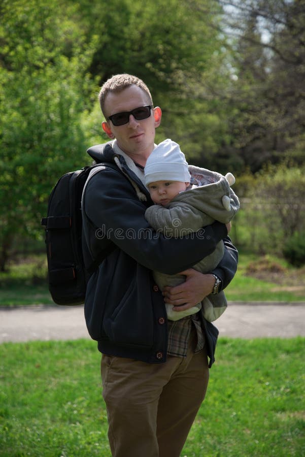 Daddy with the Baby in the Park Stock Image - Image of backpack, blue ...
