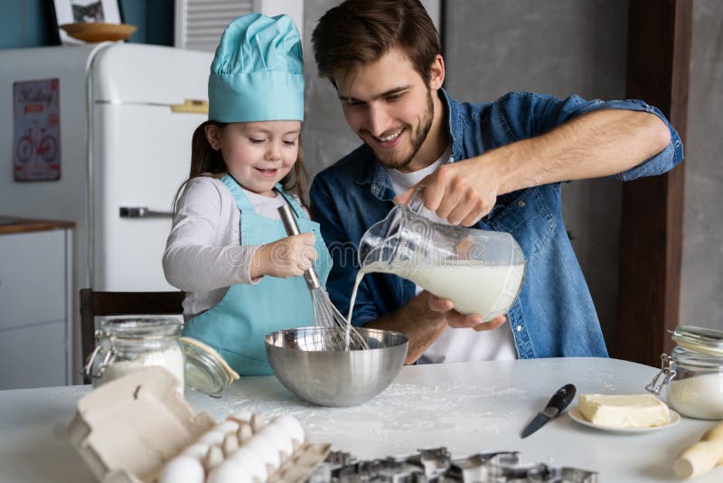 Daddy with Daughter Baking Cake Together in Home Kitchen. Stock Photo ...
