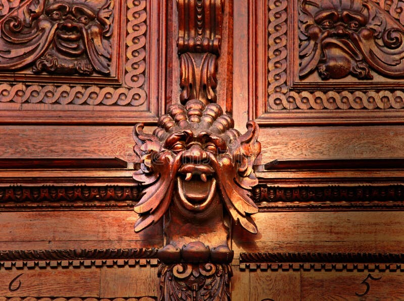 The Daemon Face - Medieval Wood Carving Stock Image - Image of gate ...