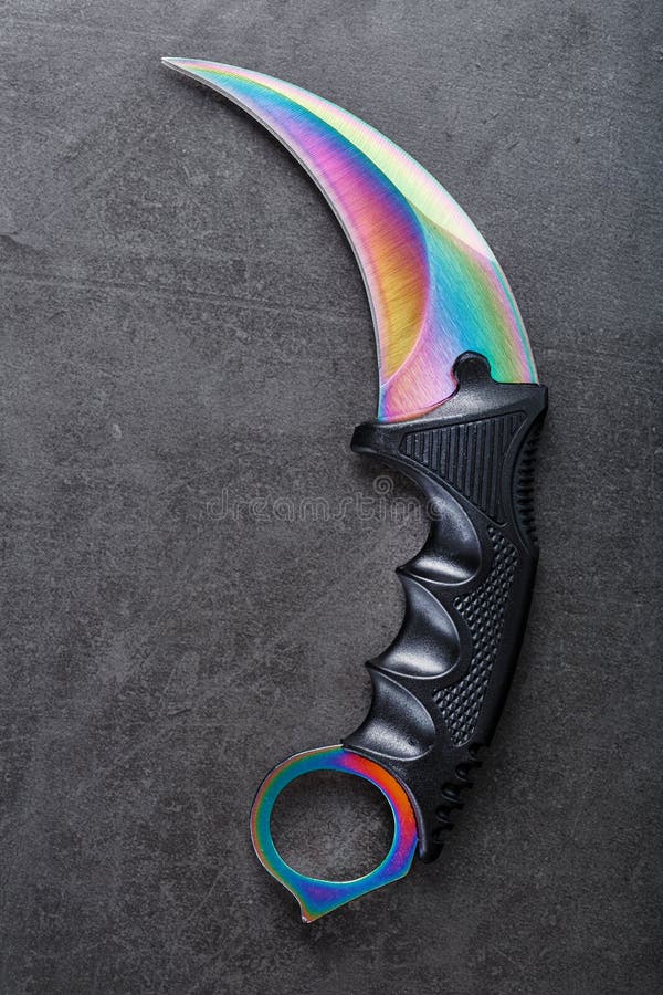 A Dagger with a Steel Blade with a Gradient Color on a Black Background ...