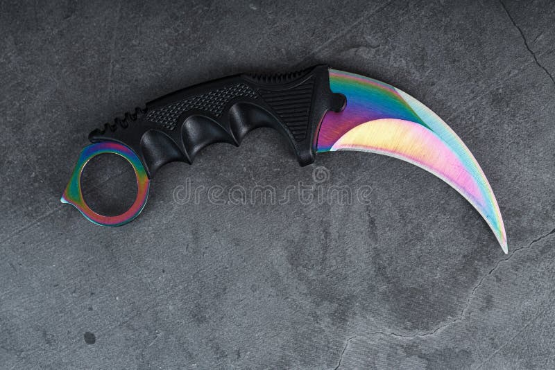 A Dagger with a Steel Blade with a Gradient Color on a Black Background ...
