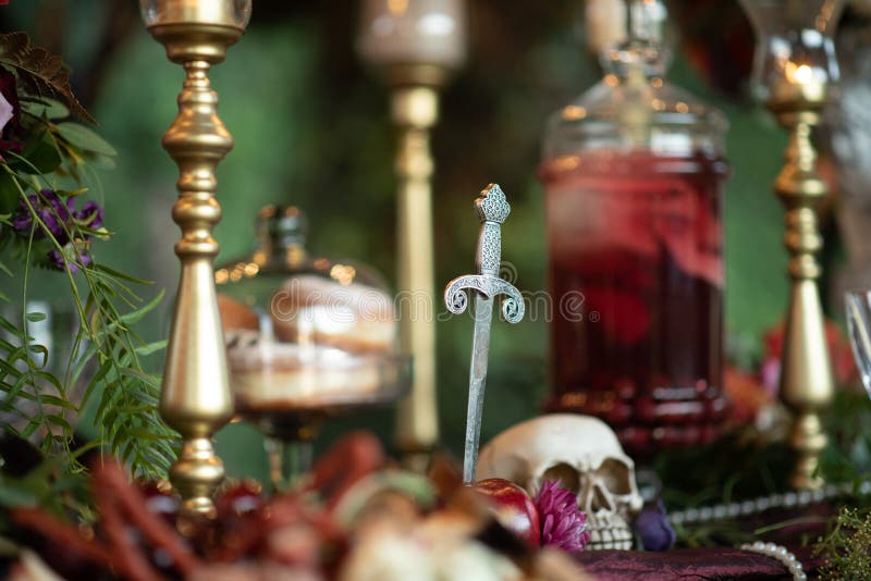 Dagger on Table Prepared for Halloween Stock Photo - Image of fruit ...