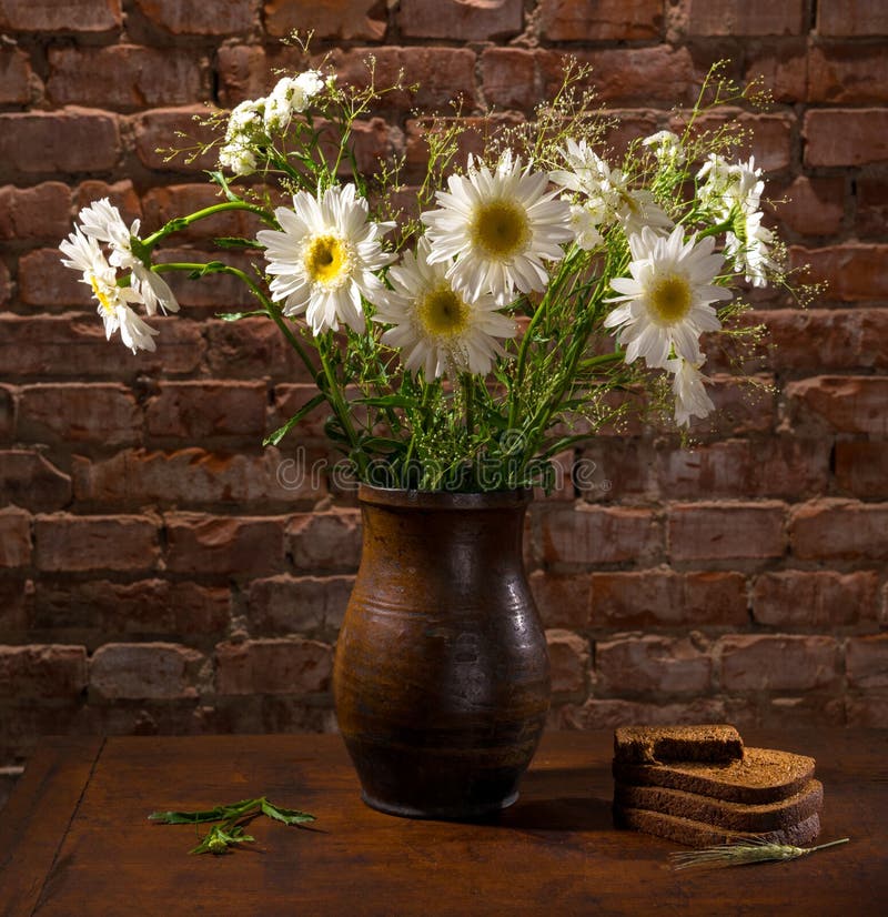 Daisies in Vase and Bakery Pieces of Bread Stock Photo - Image of bread ...