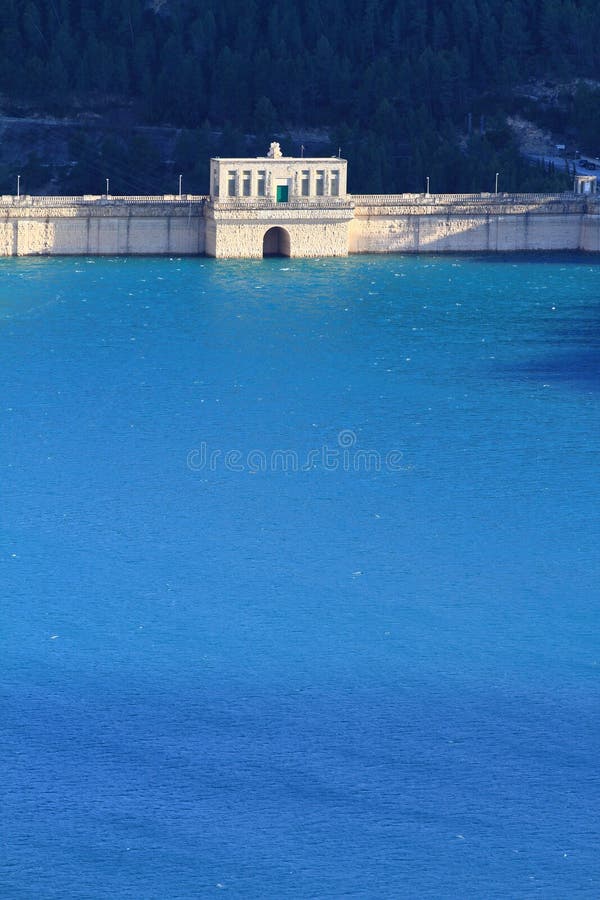 Dam with blue bright water stock image. Image of downhill - 24395533
