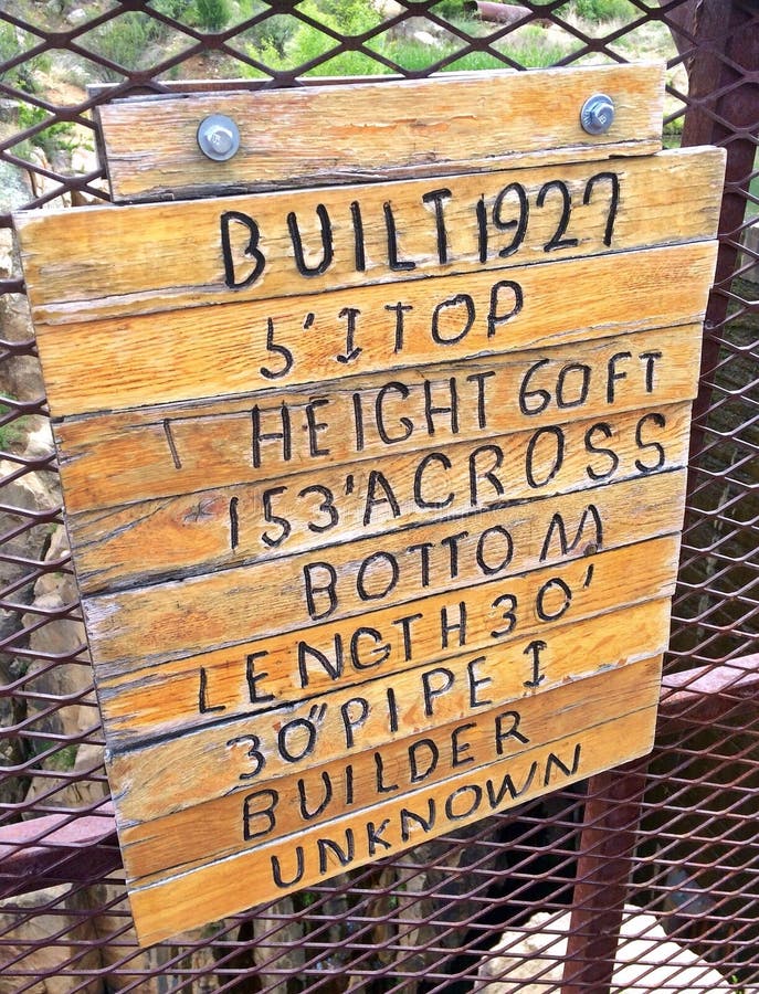 Dam Bridge Sign stock photo. Image of mountains, bridge - 76111696