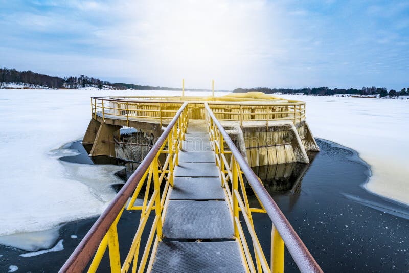 Dam on the frozen river stock photo. Image of scenic - 239725654