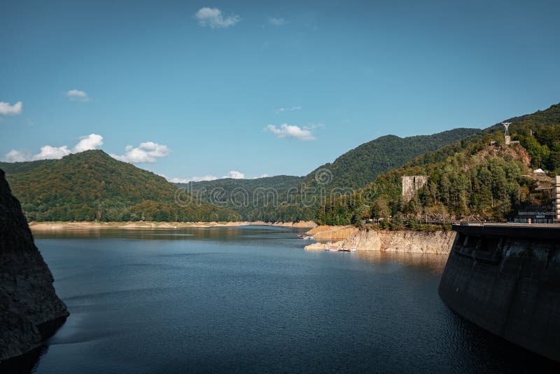Dam Over the Arges River Surrounded by Lush Green Mountain Forests in ...