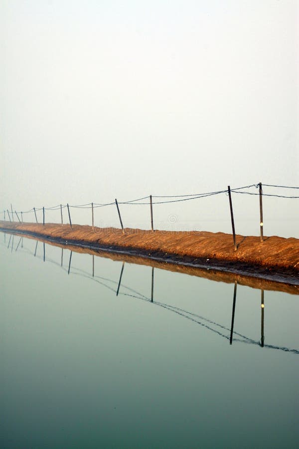 Dam and pole in the water stock image. Image of water - 370504713