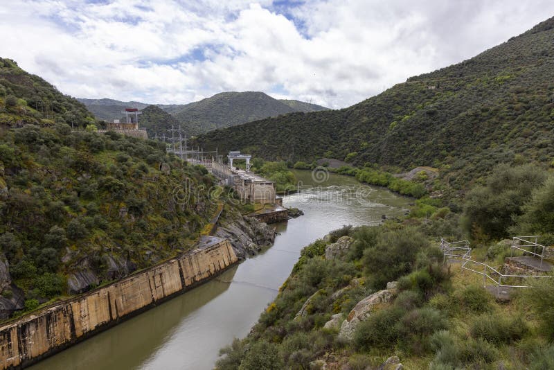 Dam Structure Overlooking a Flowing River and Hills Stock Photo - Image ...