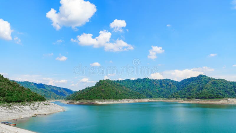 Dam View with Emerald Green Water There are Green Mountains Stock Photo ...