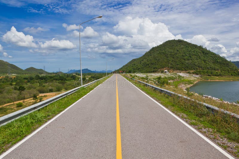 The dam wall with road stock image. Image of canal, cloudscape - 25690399
