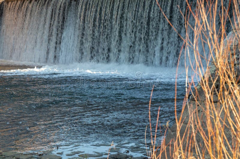 A Dam with Water Cascading Down Like a Waterfall. the Powerful Flow ...