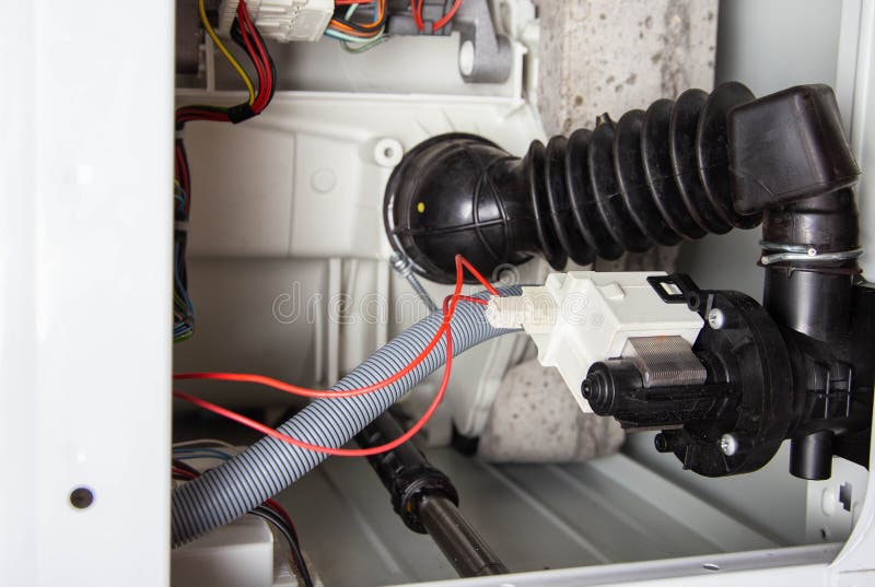 Damage and Replacement of the Washing Machine Drain Pump, Close-up ...