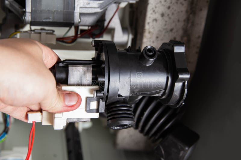 Damage and Replacement of the Washing Machine Drain Pump, Close-up ...