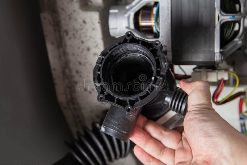 Damage and Replacement of the Washing Machine Drain Pump, Close-up ...