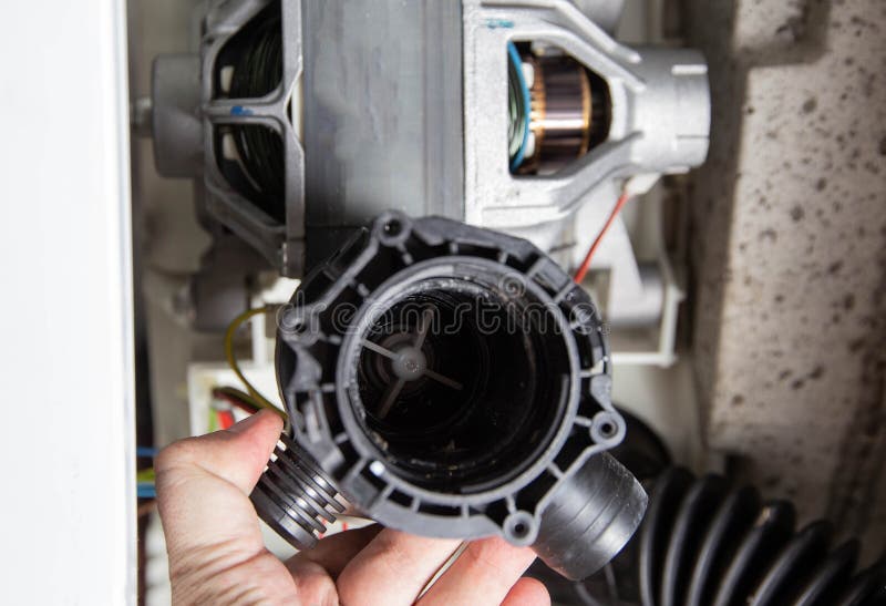 Damage and Replacement of the Washing Machine Drain Pump, Close-up ...