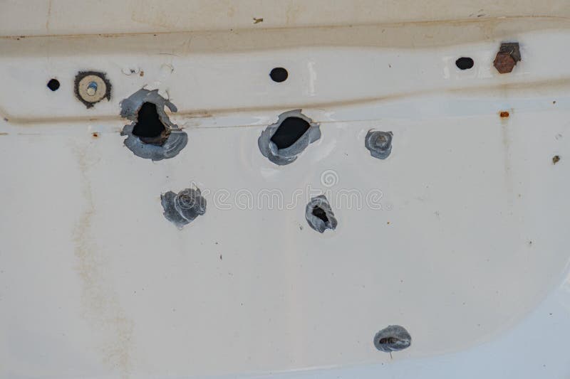 Damage after Shelling. Bullet Holes in the Red Metal. Old Rusty Surface ...