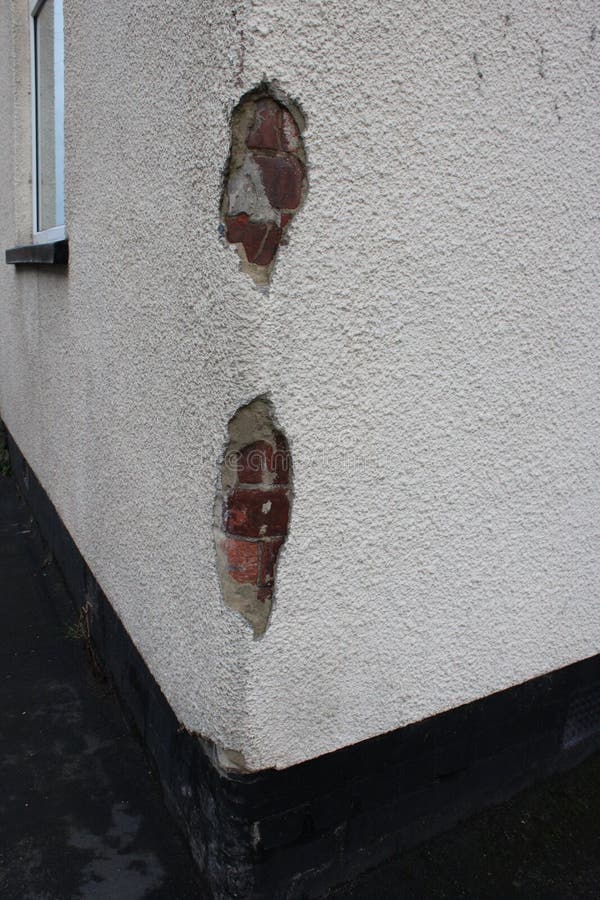Damage To House Rendering Revealing Brickwork Underneath Render Stock ...