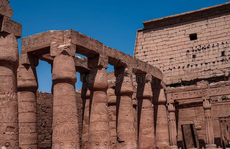 Damaged Ancient Egyptian Temple with a Blue Sky in the Background ...