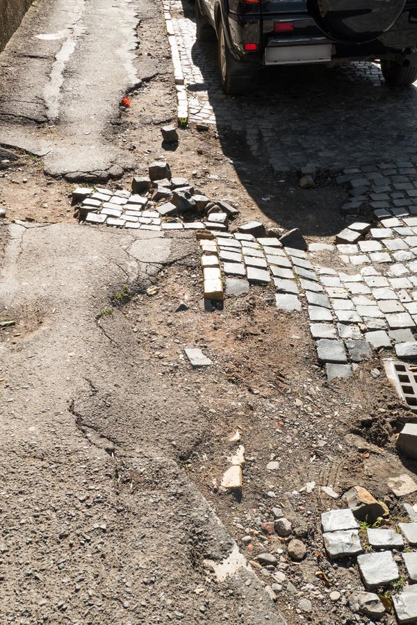 Damaged Asphalt Pavement with Potholes. Bad Road Stock Photo - Image of ...
