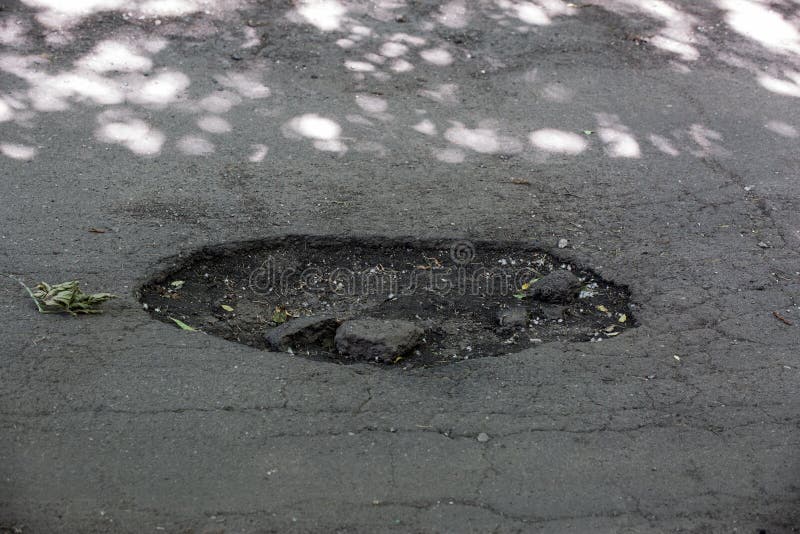 Pothole in Pavement Signifying Failing Infrastructure. Pathole on the ...