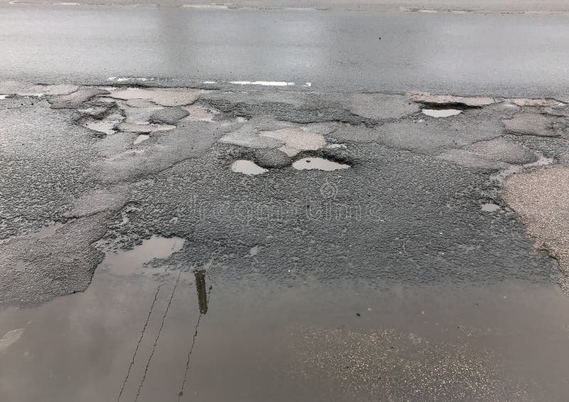 Damaged Asphalt Road with Potholes Stock Photo - Image of cracks ...