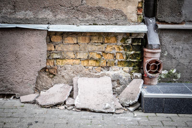 Damaged Building Facade. Water Drainage and Street View Stock Image ...
