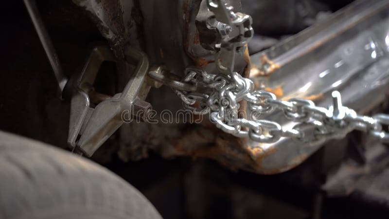 Damaged Car Body is Pulled Out Using a Chain and Hydraulics. Repair ...