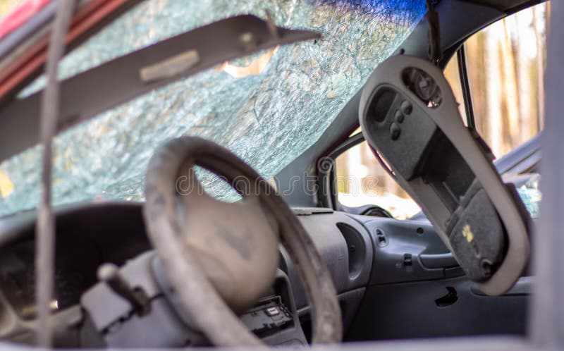 Damaged Car Window after an Accident. Broken Windshield As a Result of ...