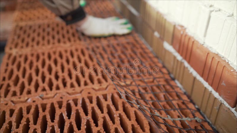 Damaged Ceramic Block of Orange Color. Ceramic Blocks. Worker Puts a ...