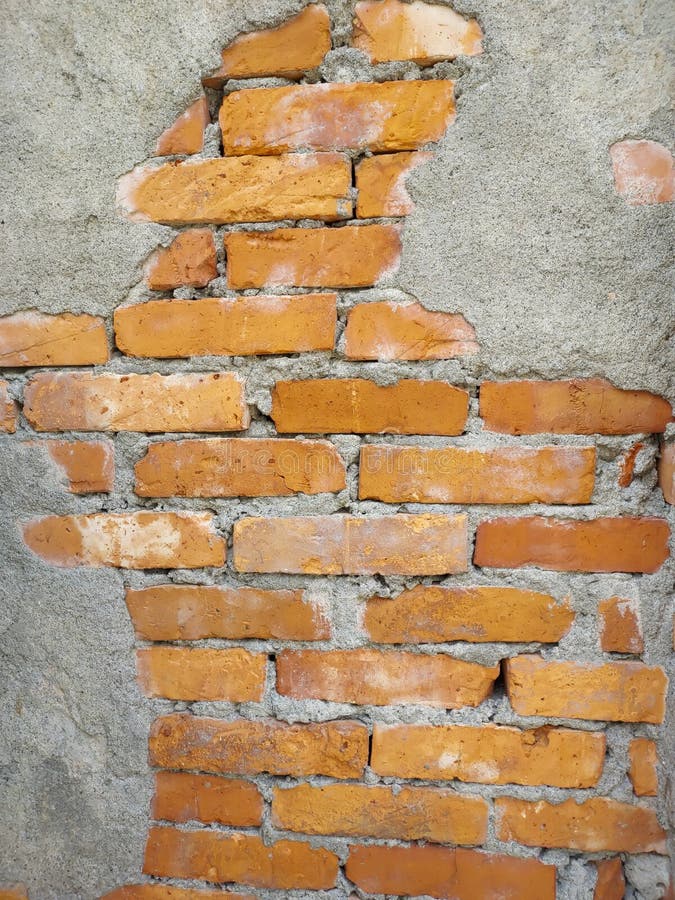 Damaged Concrete Wall with Red Bricks Exposed Stock Image - Image of ...