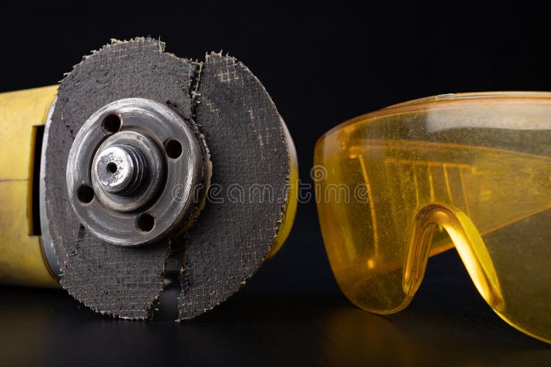 Damaged Cutting Disc for Metal in an Angle Grinder. Power Tools in a ...