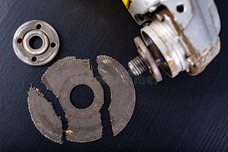 Damaged Cutting Disc for Metal in an Angle Grinder. Power Tools in a ...