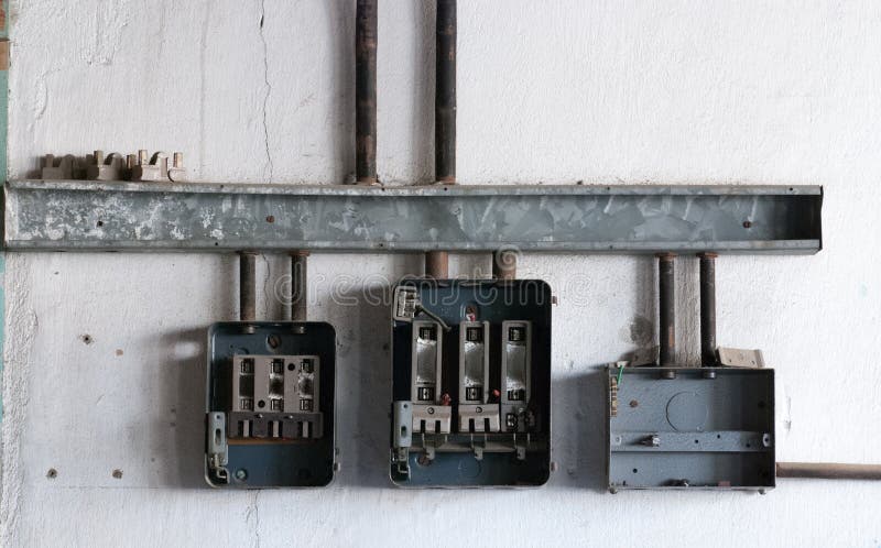 Damaged Electrical Switchport Control Panel on a White Wall Stock Image ...